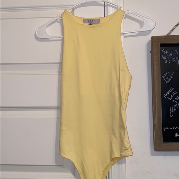 Tops | Pastel Yellow Bodysuit | Poshmark